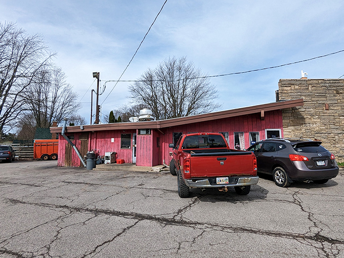 The unassuming pink exterior of Porky's Drive In stands as a time capsule of Americana, where culinary memories have been made since long before "retro" became trendy.