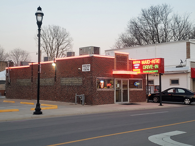 That neon sign doesn't lie – this brick beauty promises sandwich perfection and delivers beyond your wildest dreams.