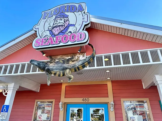 The coral-colored beacon of Florida's Seafood Bar & Grill stands out against the Cocoa Beach sky, promising seafood treasures that locals have been quietly hoarding for themselves.