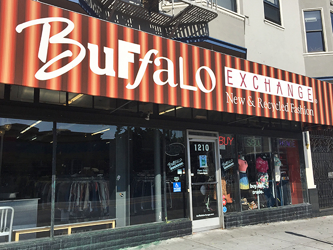 The iconic red-striped Buffalo Exchange storefront beckons fashion hunters like a beacon of sustainable style on Haight Street.