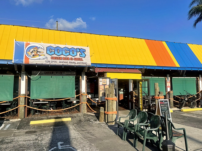 The sunshine-yellow exterior of Coco's isn't just a building—it's a mood announcement. Florida casual meets Maryland seafood tradition under those blue Surfpind umbrellas.