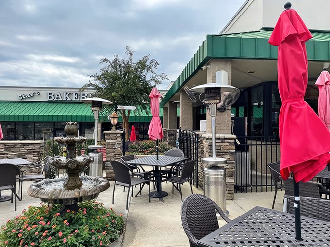 The welcoming exterior of Stax Omega beckons hungry travelers like a lighthouse guiding ships to delicious harbor in Greenville.