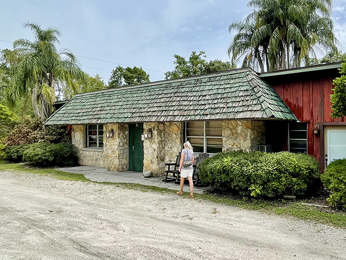 The stone facade and green shingled roof welcome you like an old friend – rustic charm that promises something more authentic than your average roadside eatery.