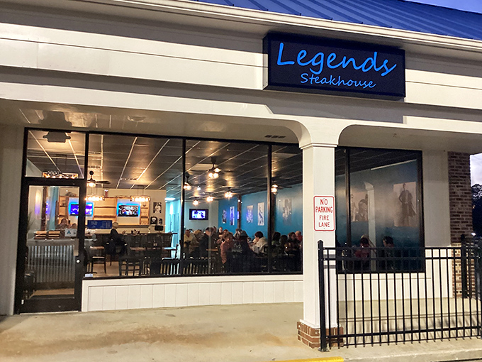 The blue neon sign beckons like a lighthouse for the hungry, promising legendary steaks behind those welcoming windows. Newberry's worst-kept culinary secret.