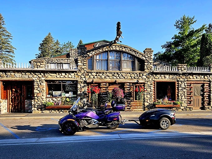 Stone walls that tell stories, upside-down stove legs that defy gravity—this isn't just a restaurant, it's a Michigan folk art masterpiece watching over Lake Michigan.