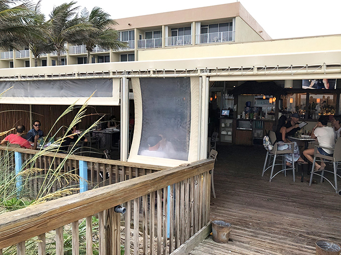 The beachside entrance to Shuckers welcomes diners with coastal charm and the promise of ocean breezes – Florida dining as it should be.