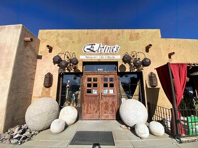 The adobe-style entrance to Elvira's welcomes you with rustic wooden doors and dramatic metal ornaments—like stepping into a secret Mexican courtyard.