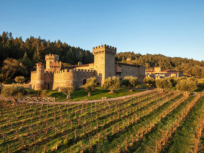The imposing stone facade of Castello di Amorosa stands against the California sky, looking like it was plucked straight from a Tuscan hillside and dropped into Napa Valley.