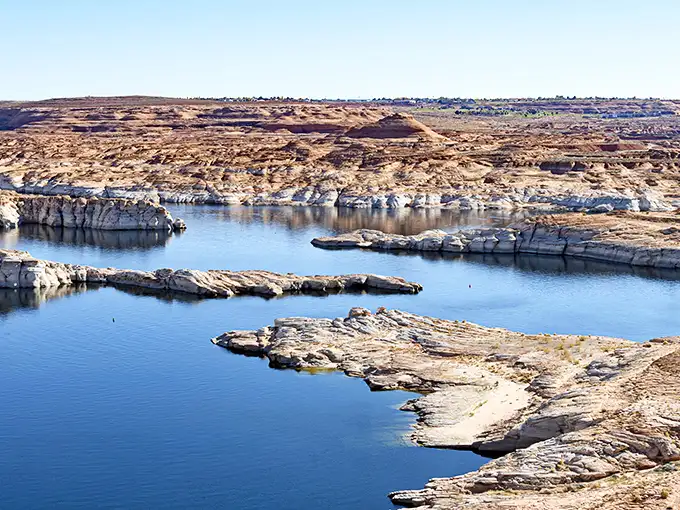 Mother Nature showing off again! The dramatic contrast between Lake Powell's azure waters and the rusty red cliffs creates a painting that no artist could fully capture.
