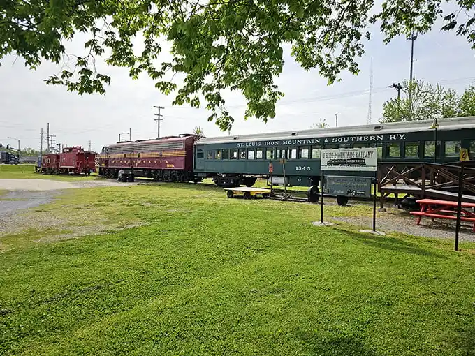 The crimson and gold locomotive sits majestically against the blue Missouri sky, like a time machine ready to whisk you back to the golden age of rail travel.