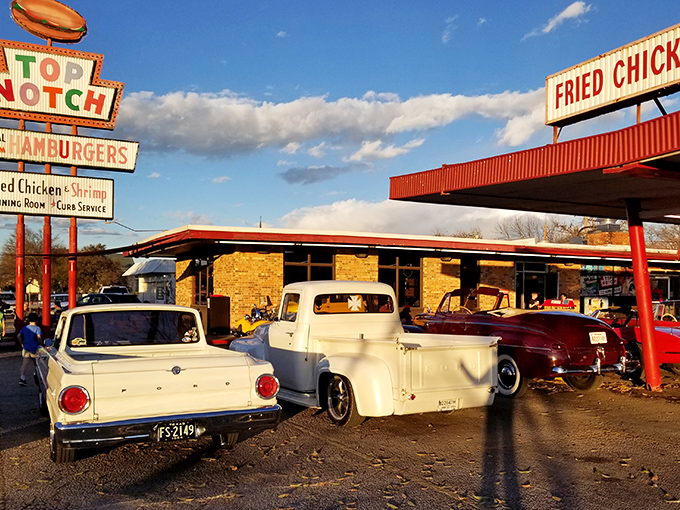 That iconic neon sign has been beckoning hungry Austinites since 1971—a beacon of burger bliss on Burnet Road that promises time travel with every visit.
