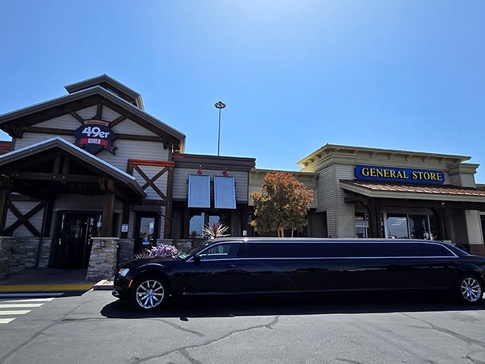 The 49er Diner's rustic exterior welcomes hungry travelers like a gold rush promise – comfort food treasures await just beyond those wooden beams and stone pillars.