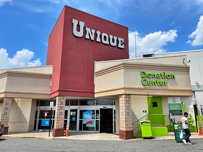 The iconic red tower of Unique Thrift Store stands like a beacon for bargain hunters, promising treasures within its massive walls.
