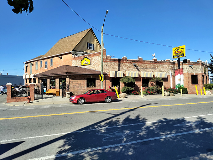 The unassuming exterior of Taqueria Mi Pueblo might not scream "culinary revelation," but that yellow sign is basically a beacon for flavor-seekers in Detroit's Mexicantown.