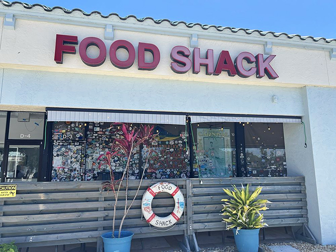 The unassuming strip mall exterior of Food Shack proves once again that culinary treasures often hide in plain sight.
