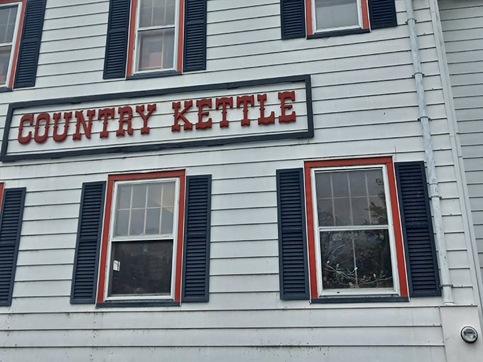 That classic red-and-white storefront isn't trying to fool anyone – it's exactly as charming inside as it promises.