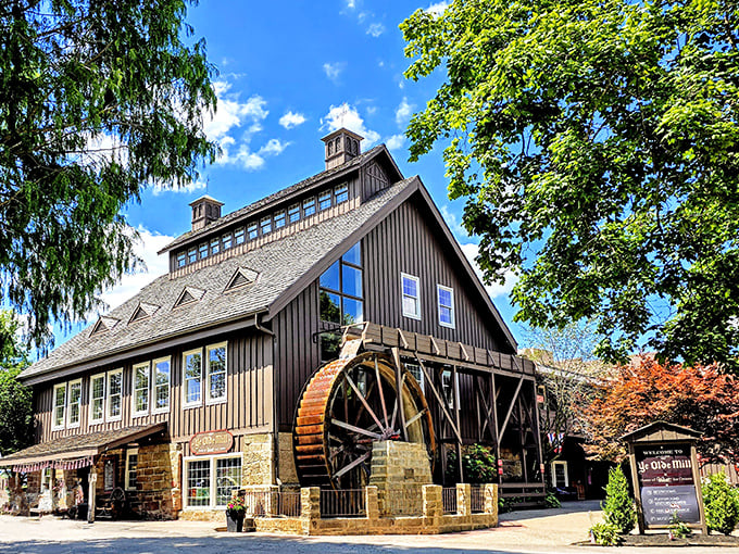 The historic Ye Olde Mill stands proudly against an Ohio blue sky, its wooden water wheel ready to churn—much like they've been churning ice cream since 1914. 