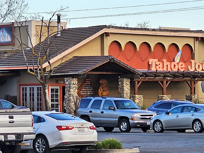The iconic Tahoe Joe's sign welcomes hungry travelers like a mountain oasis in Fresno's urban landscape. Those stone pillars aren't just for show—they're holding up decades of steak-loving traditions.
