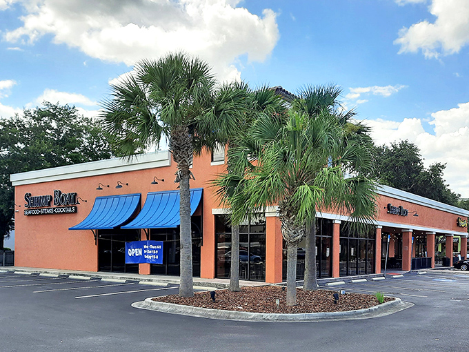 The orange exterior might not scream "culinary destination," but that glowing sign is like a lighthouse guiding hungry seafood lovers to shore.