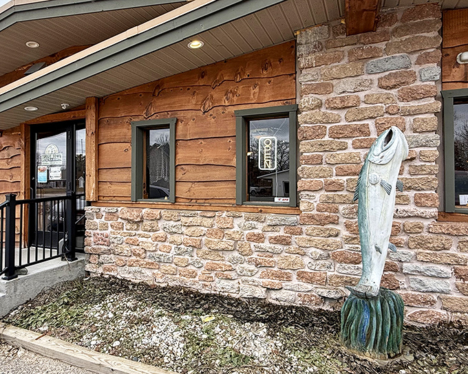 The rustic log cabin exterior isn't just Instagram-worthy—it's the perfect prelude to the culinary treasures waiting inside this northern Michigan gem.