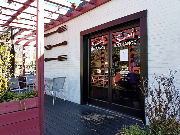 The vine-draped porch of Scrambled welcomes you like a Southern grandmother's hug—rustic, charming, and promising something delicious inside.