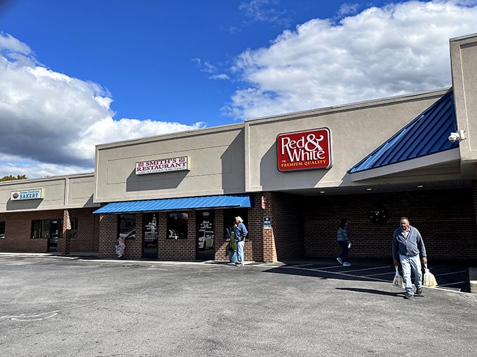 The unassuming brick façade with its bright blue awning promises no frills, just honest-to-goodness Southern cooking that's worth every calorie.