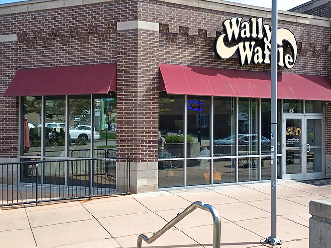 The bright yellow Wally Waffle sign beckons like a breakfast lighthouse, promising carb-laden salvation to hungry Akronites.