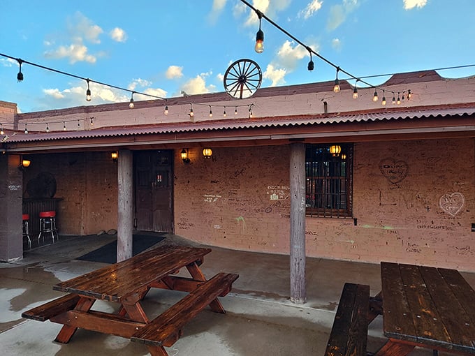 The adobe façade and weathered wooden posts aren't just Instagram-worthy – they're time machines to the Old West, complete with decades of visitor graffiti telling their own stories.