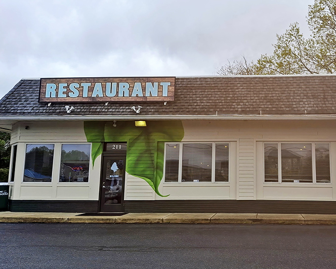 The unassuming exterior of The Backyard in Milton might fool you, but that green vine detail hints at the fresh culinary adventures waiting inside.