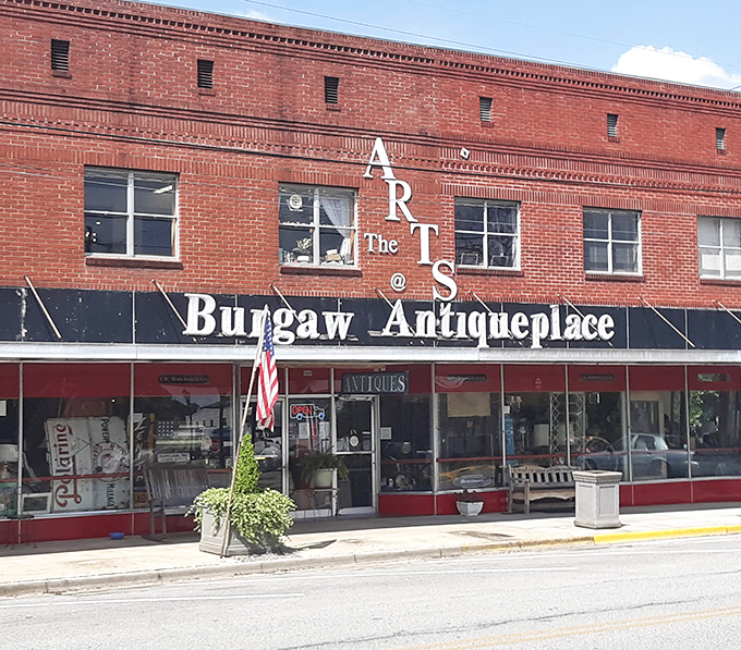 The iconic red brick façade of Burgaw Antiqueplace stands like a time capsule on the main street, beckoning treasure hunters with its vintage charm.
