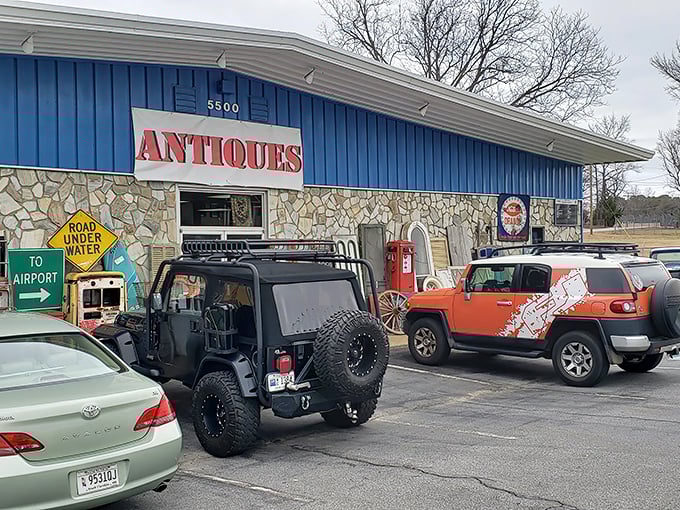 The blue facade with its bold "ANTIQUES" sign isn't just a storefront—it's a portal to decades past waiting to be explored.