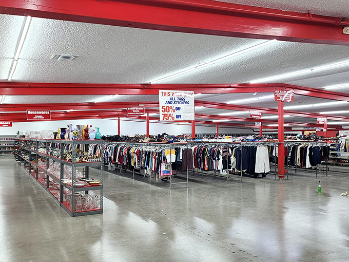 The festive red-trimmed exterior of Thrift City beckons bargain hunters with its colorful pennant flags—like a carnival where the prize is always affordable fashion.