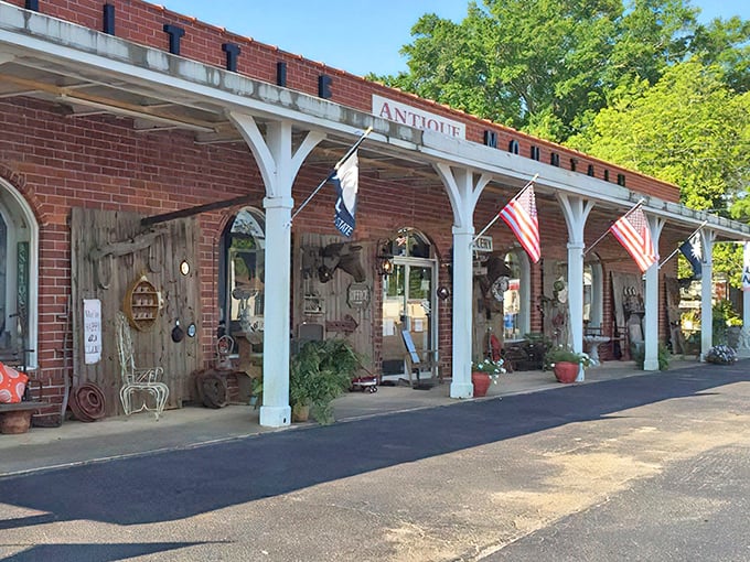 The charming brick exterior with white columns isn't just inviting—it's practically winking at you to come discover what treasures await inside.