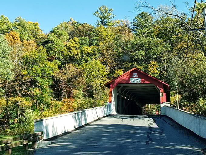 Standing proud since 1841, the Wehr Covered Bridge flaunts its crimson coat against Pennsylvania's blue skies like it's auditioning for a Norman Rockwell painting.