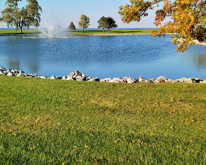 The fountain's gentle spray creates nature's own water show against the backdrop of Lake Erie's blue canvas. Serenity with special effects.