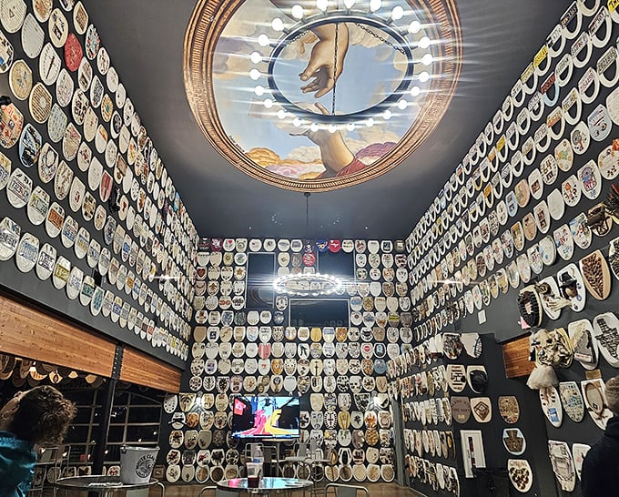 Wall-to-wall wonder! The interior of Barney Smith's Toilet Seat Art Museum showcases hundreds of decorated seats, creating an unexpectedly mesmerizing visual experience.