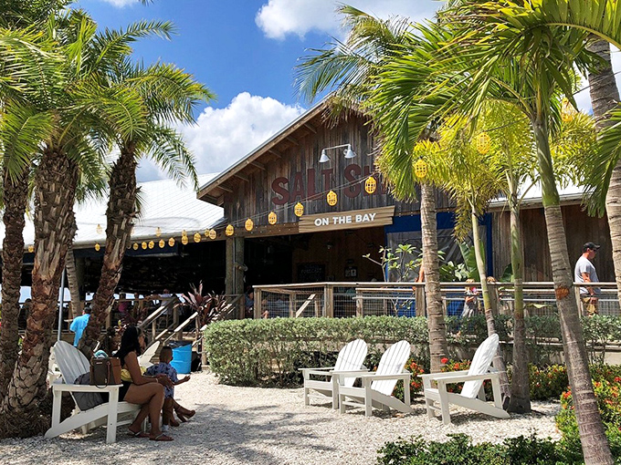 The weathered wooden charm of Salt Shack on the Bay beckons like an old friend, promising Florida sunshine and seafood treasures within.