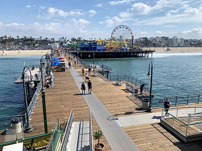 Sun-soaked boardwalk dreams come to life where wooden planks meet Pacific blue, creating California's perfect postcard moment at Santa Monica Pier.