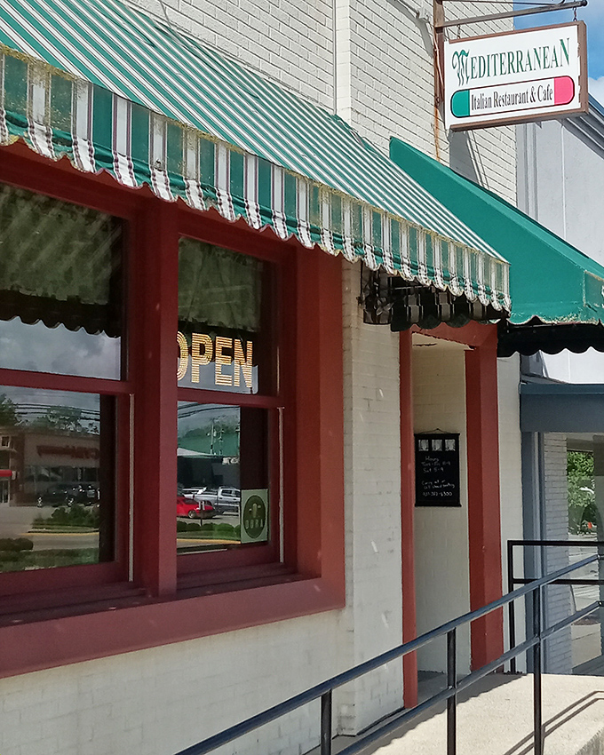The classic green and white awning beckons like an old friend on Wilmington's Main Street—a promise of Mediterranean magic in small-town Ohio.