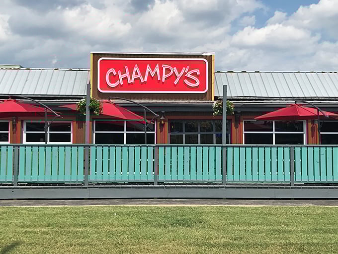 The glowing red Champy's sign beckons hungry travelers like a Southern food lighthouse guiding ships to delicious shores.