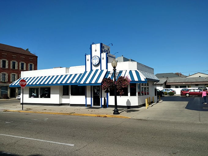 The blue and white striped awning of Carl's Townhouse stands out like a beacon of breakfast hope in downtown Chillicothe, promising delicious nostalgia inside.