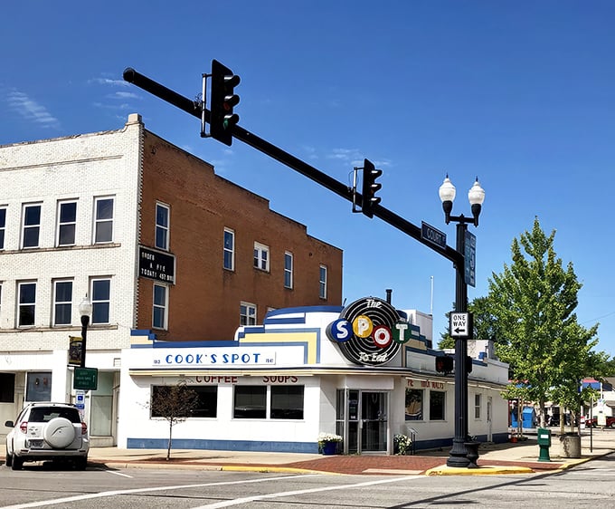 The blue and white Art Deco façade of The Spot stands proudly on Sidney's corner, its vintage neon sign beckoning hungry travelers like a culinary lighthouse.