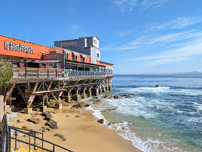 Perched dramatically over Monterey Bay, Fish Hopper's orange and blue exterior isn't just eye-catching—it's practically waving "come eat here" in maritime flag code.