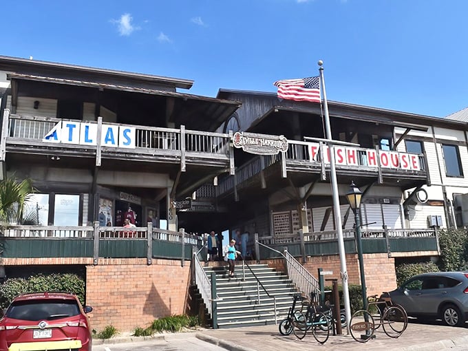The Fish House stands like a coastal postcard come to life, with its waterfront perch offering diners front-row seats to Pensacola Bay's daily show.