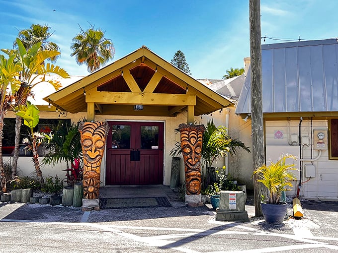 Tiki guardians flank the entrance to SeaBreeze Island Grill, promising tropical flavors and Florida vibes before you even step inside.