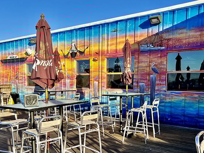 The sunset mural at Singleton's isn't just decoration—it's a promise of the colorful seafood experience waiting inside this Jacksonville waterfront gem.