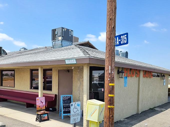 The unassuming exterior of Flo's Airport Cafe stands like a time capsule at Chino Airport, promising comfort food that's been fueling pilots and locals for generations.