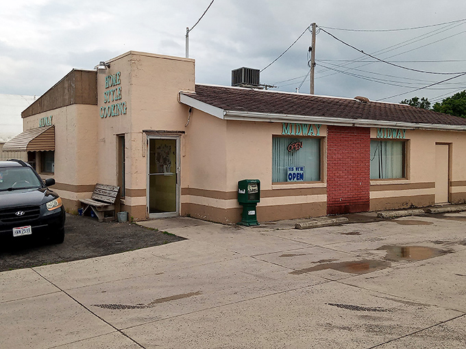 The unassuming beige exterior of Midway Restaurant stands as a beacon of breakfast hope in Kenton, where culinary magic happens without fanfare.