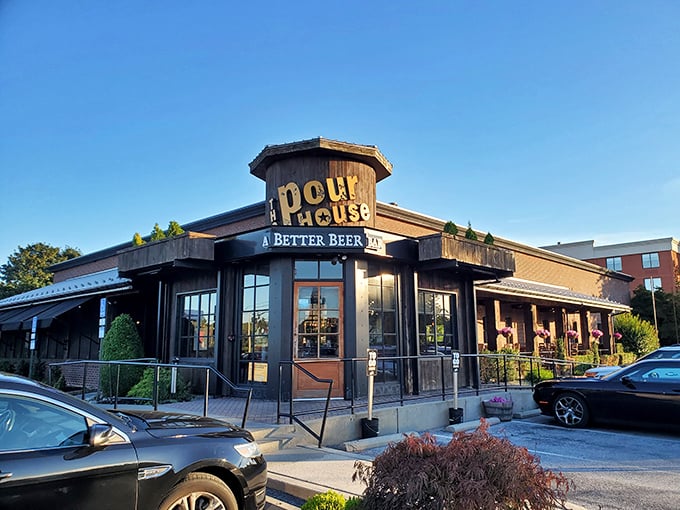 The Pour House stands like a rustic beacon of culinary promise, its wooden facade and octagonal entrance saying "yes, the food inside is as characterful as our architecture."