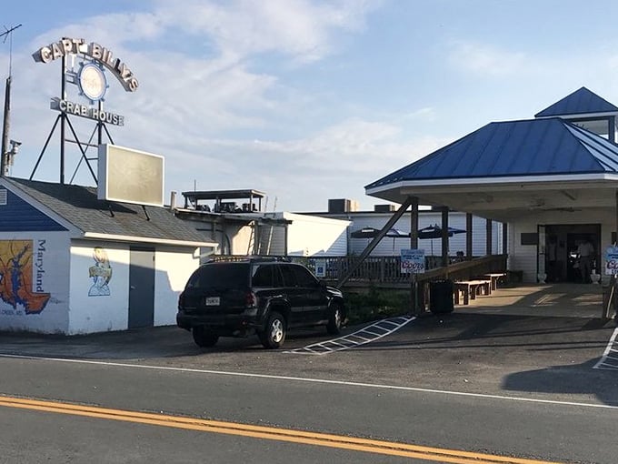 The iconic roadside sign beckons like a siren call to seafood lovers – Captain Billy's stands ready to welcome hungry travelers to crab paradise.